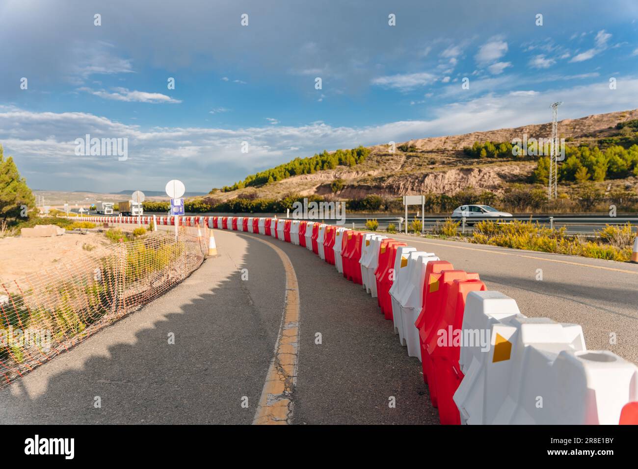 Road works sign on the road. Repair work of road signs and a bypass ...