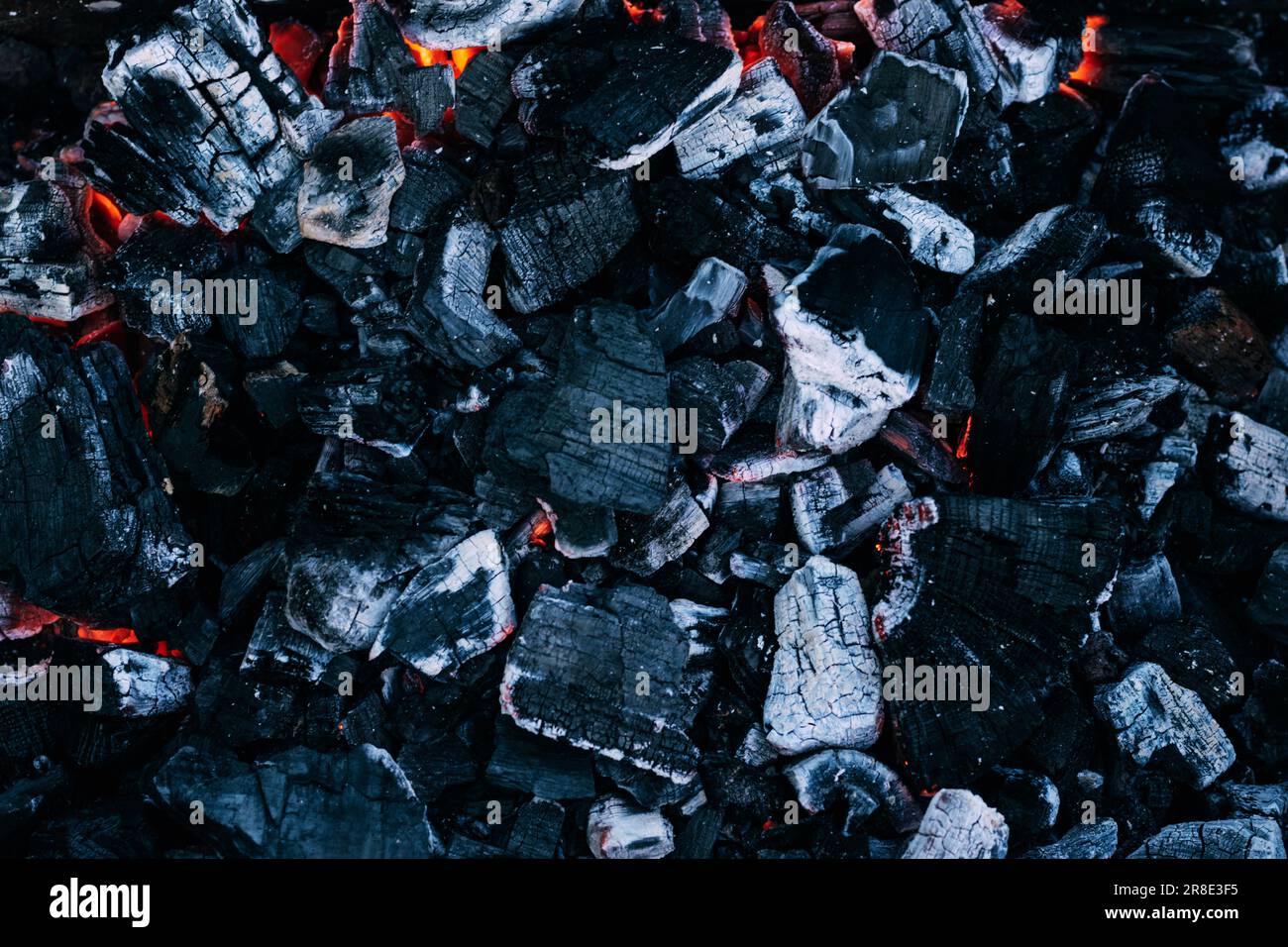 Background of burning hot coals. Burning coals in the brazier, barbecue ...
