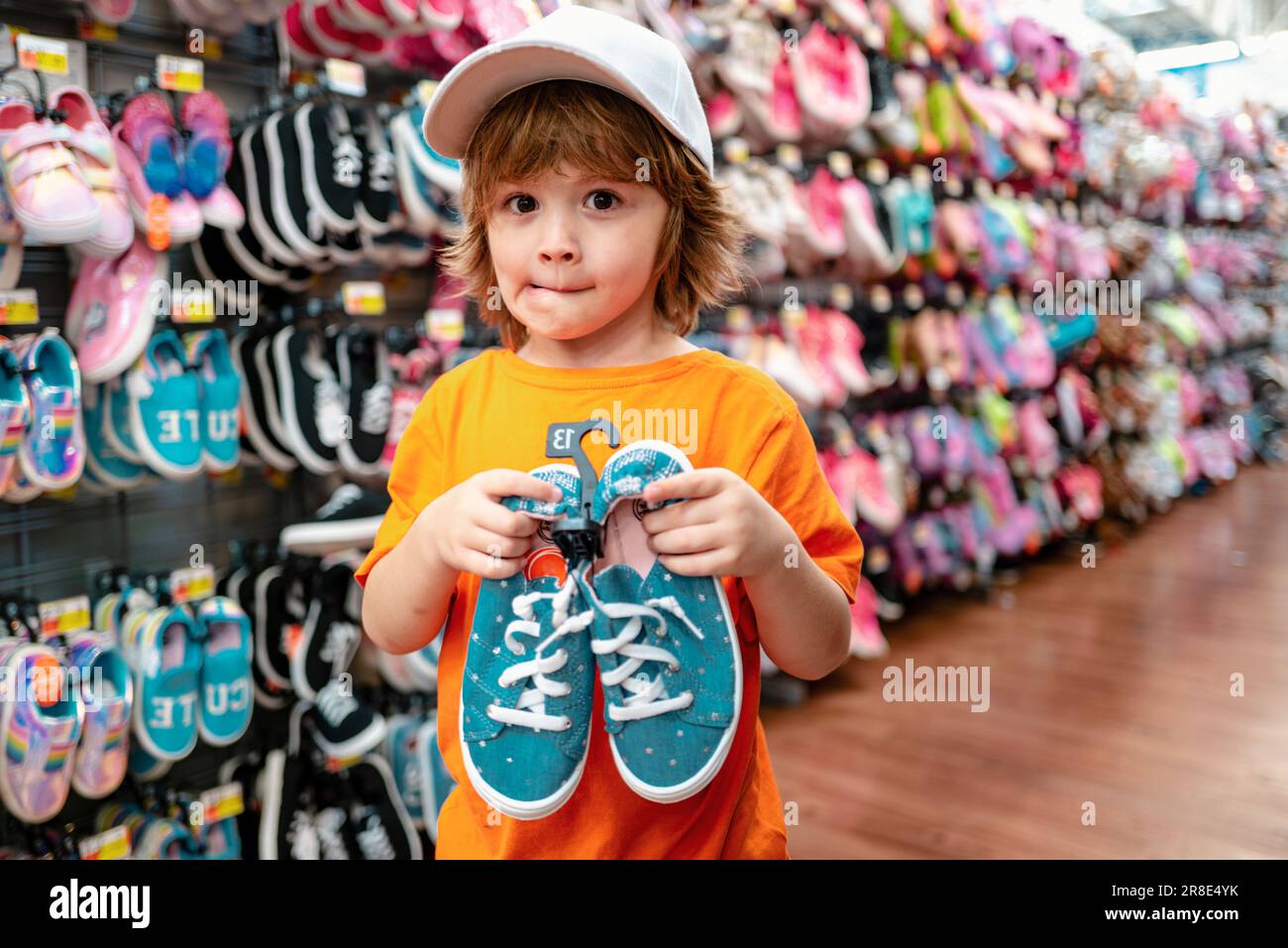Child buying shoes hi-res stock photography and images - Alamy