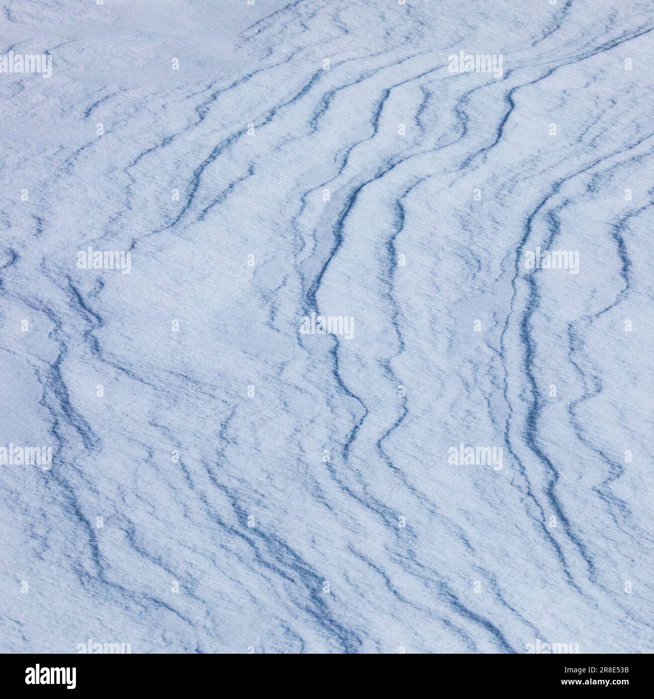 Abstract patterns on snow, full frame Stock Photo - Alamy