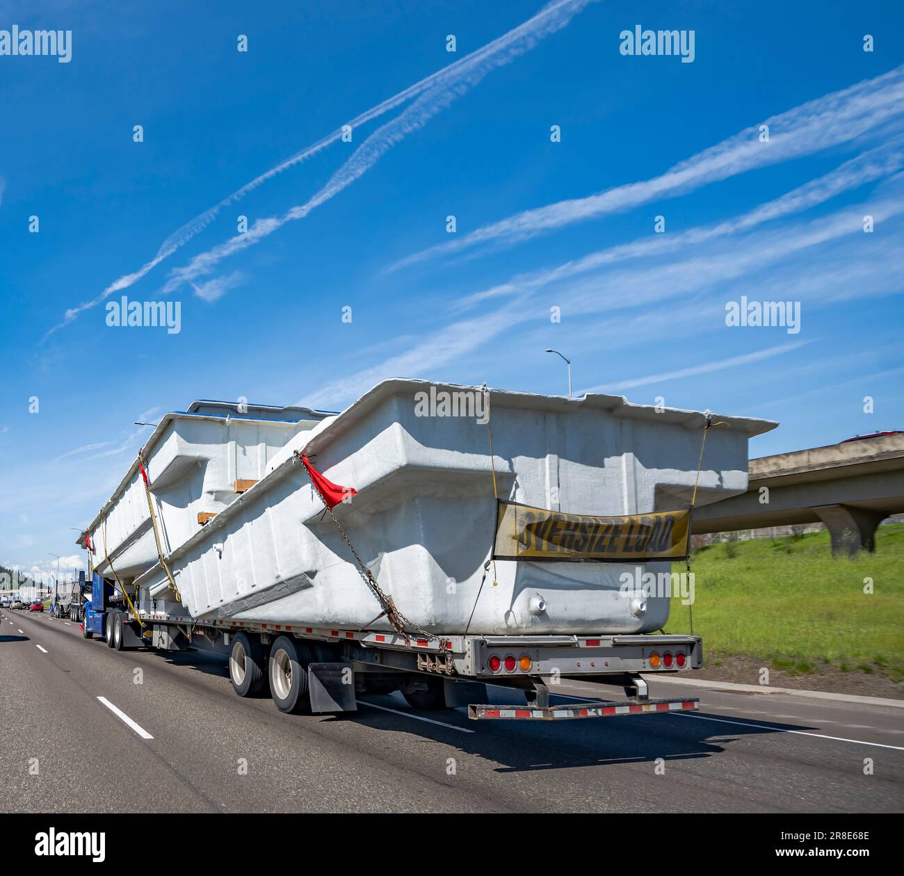 Industrial blue powerful big rig bonnet semi truck tractor transporting ...