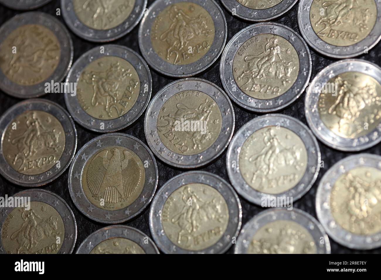 Lot of 2 euro coins close up image financial background european money ...