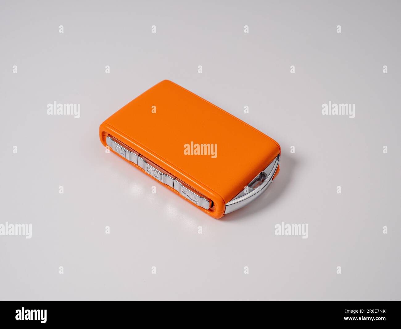 Modern wireless orange car ignition key on a white background. Wireless ...