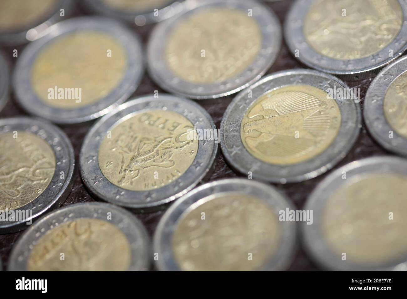 Lot of 2 euro coins close up image financial background european money ...