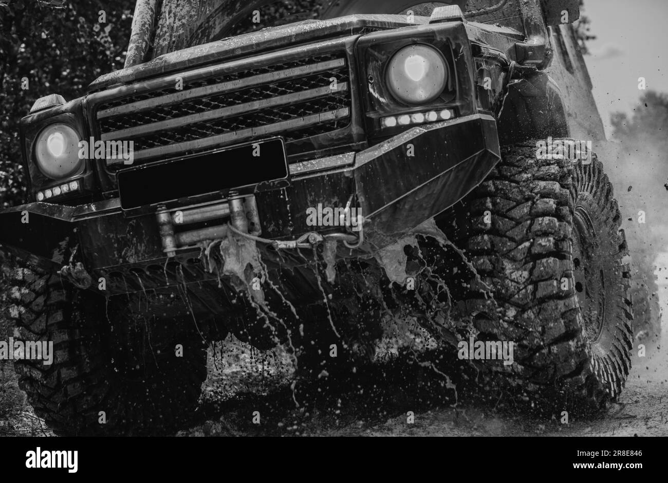 Bottom view to big offroad car wheel on country road and mountains ...