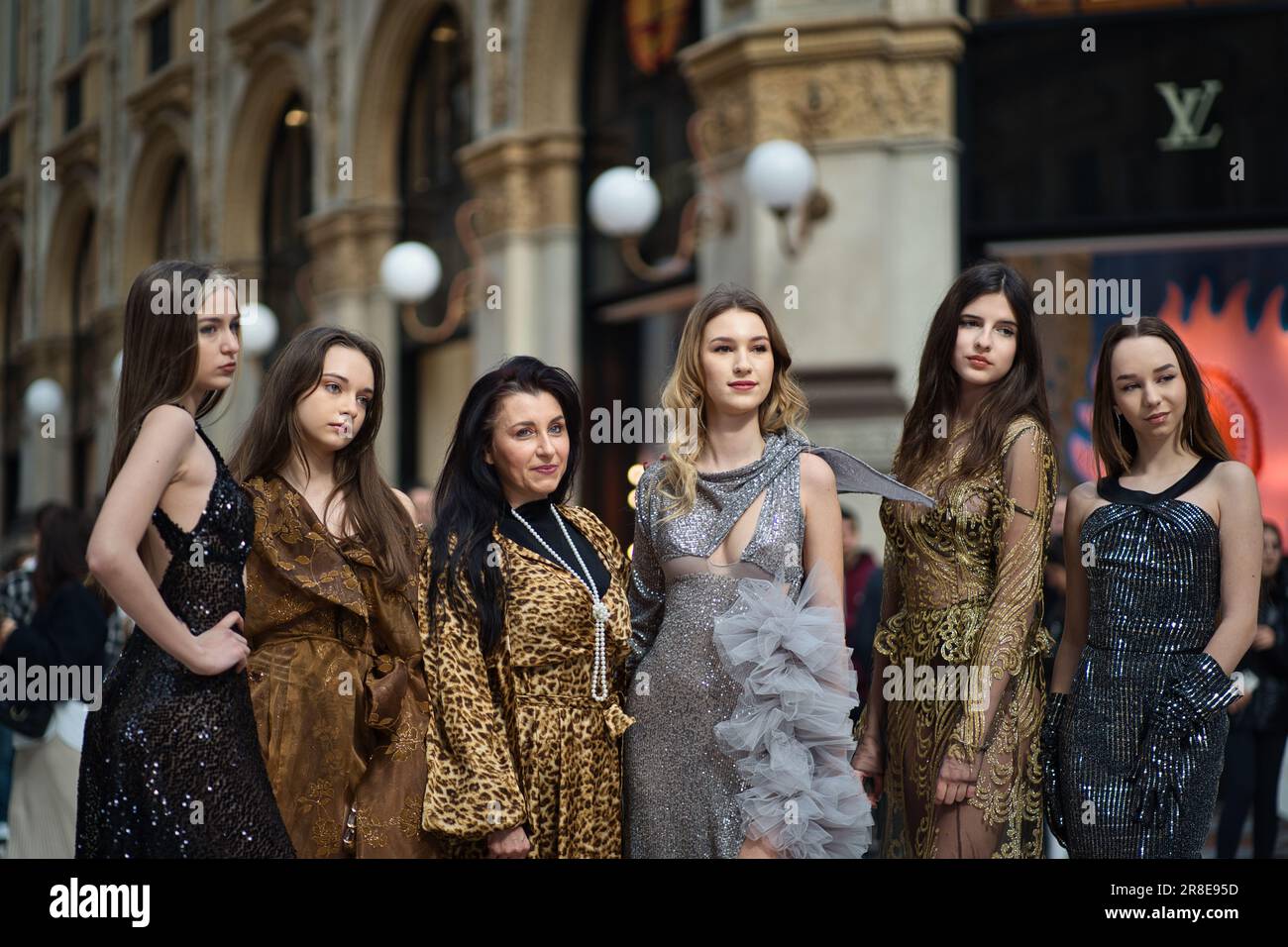 The young Caucasian models in stylish dresses posing during Milan ...