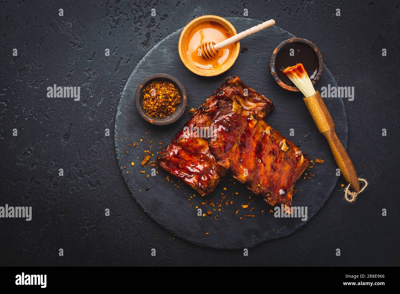 Barbecue pork spare ribs with hot honey chili marinade on black ...