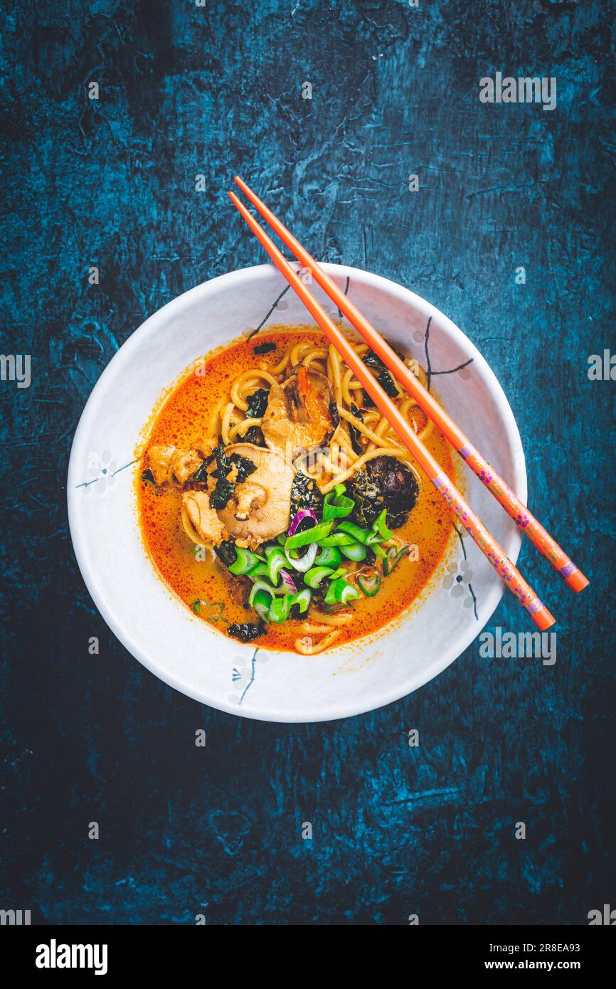 Thai red curry soup with chicken, shiitake mushrooms, coconut milk and ...