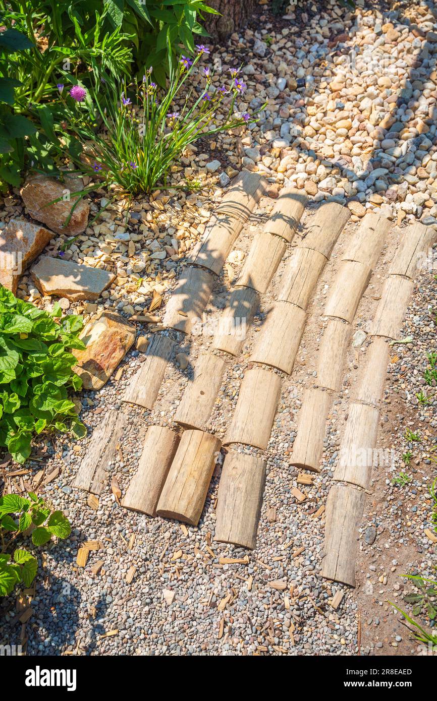 Garden path made of natural wooden planks, stones, gravel. Healthy ...