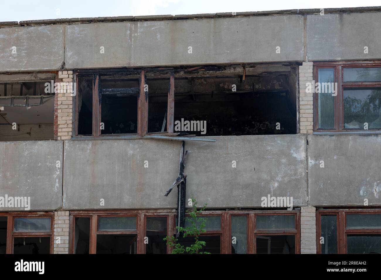 Broken windows in the facade of an old building after an accident ...