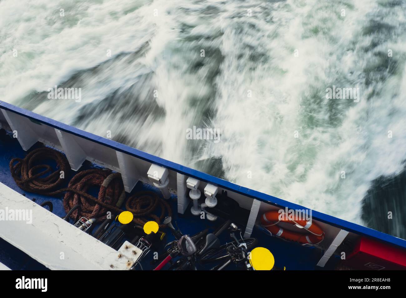 Wake of vessel. Wide wake trail from boat. Ocean water. Deep blue ...
