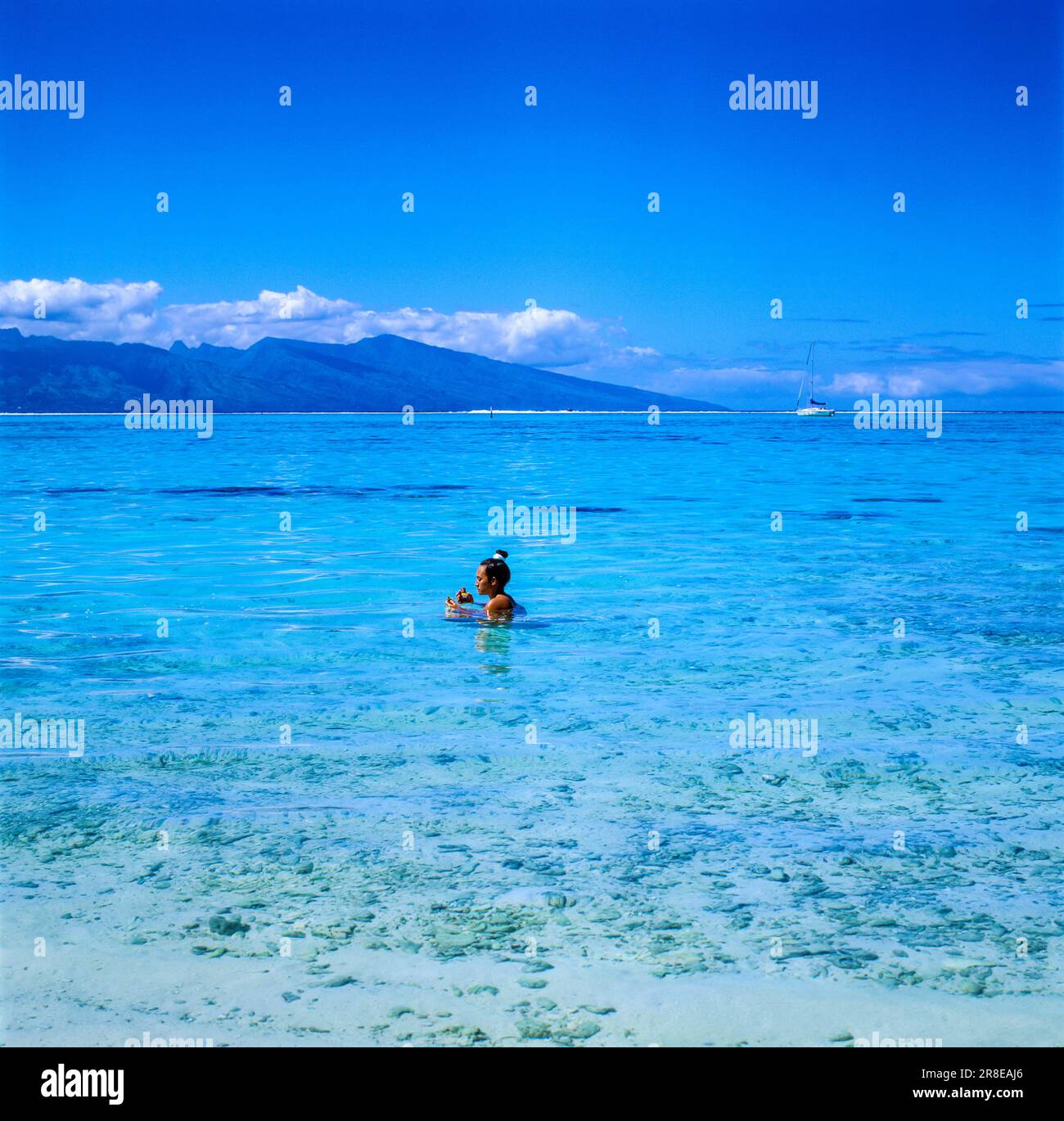 FRENCH POLYNESIA. SOCIETY ARCHIPELAGO. MOOREA ISLAND. YOUNG POLYNESIAN ...