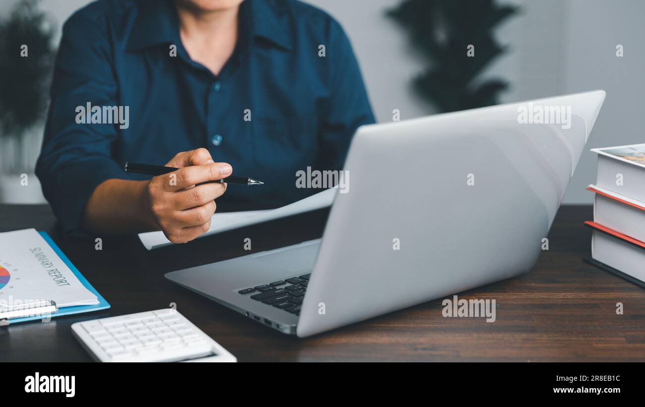 Young woman of banking finance officer using computer laptop and use ...