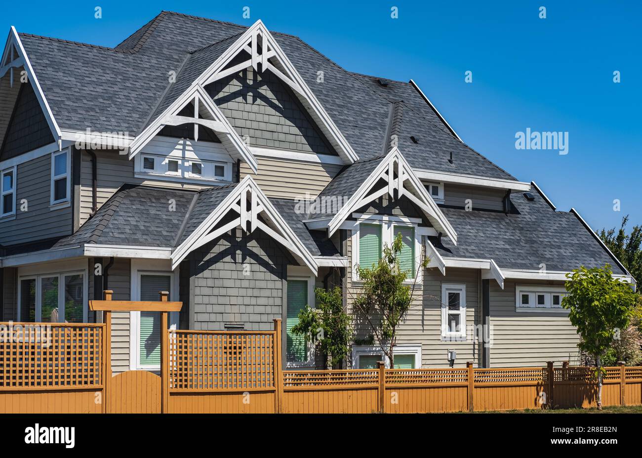 Real Estate Exterior Front House on a sunny day. Big custom made luxury ...