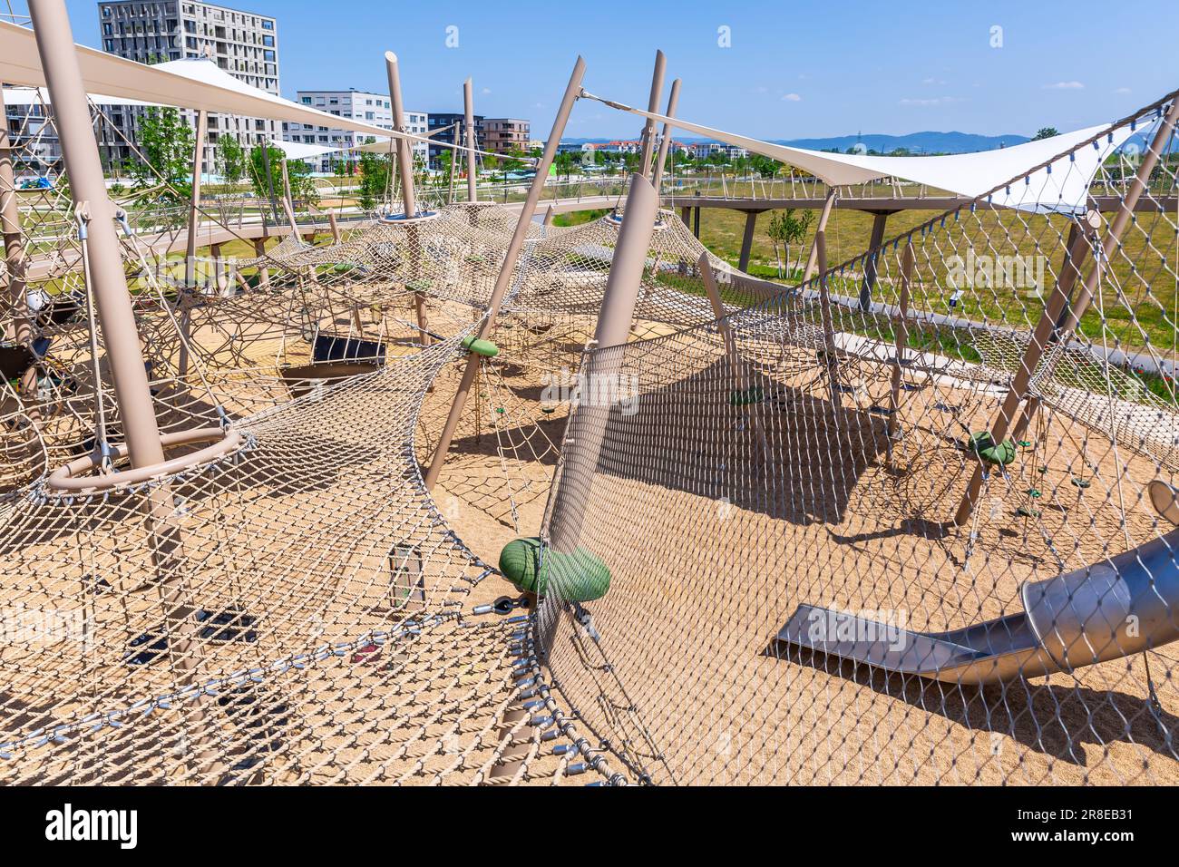 Modern wooden playground and climbing park for children and kids in ...