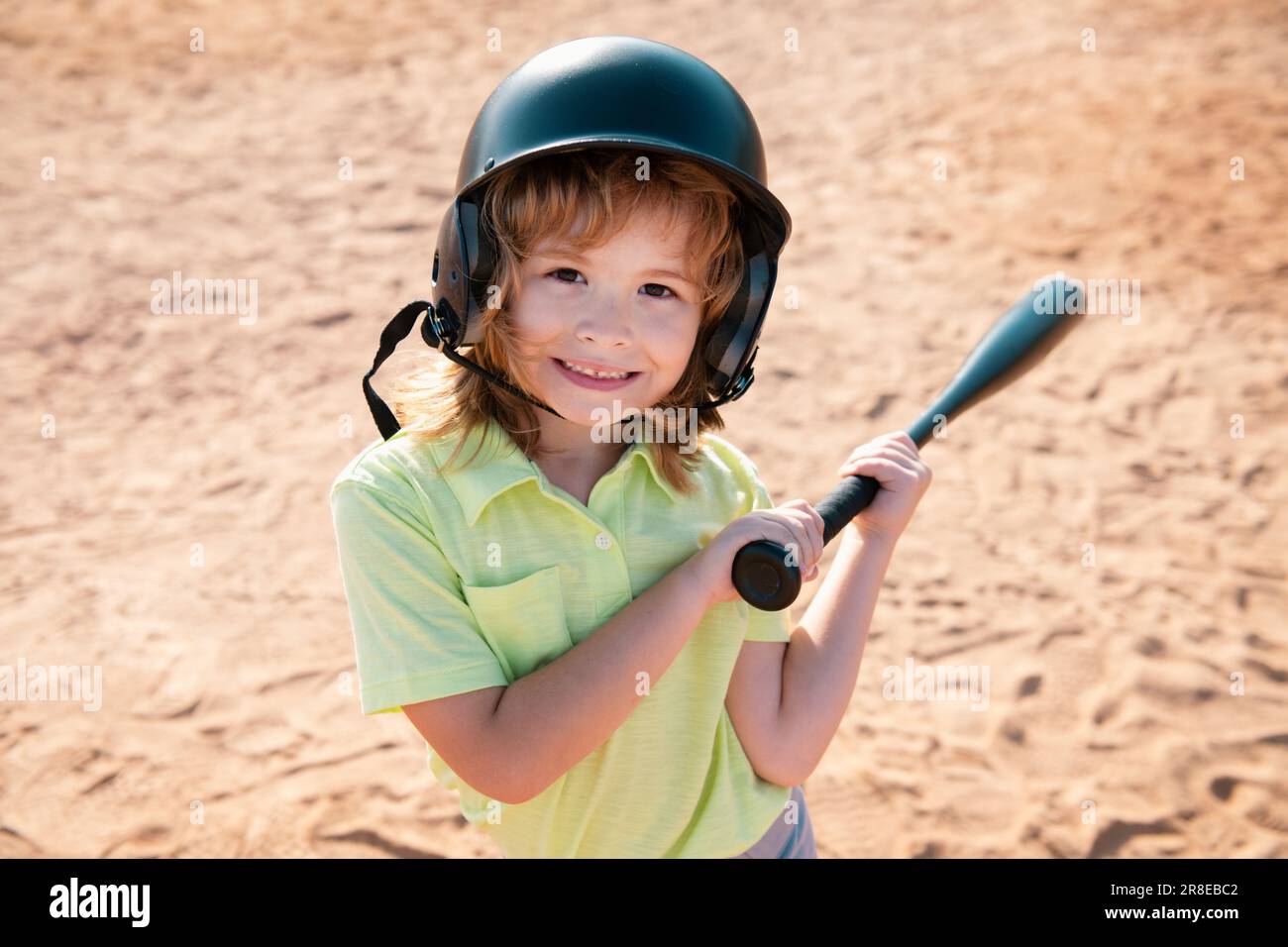 Funny kid up to bat at a baseball game. Close up child portrait Stock ...
