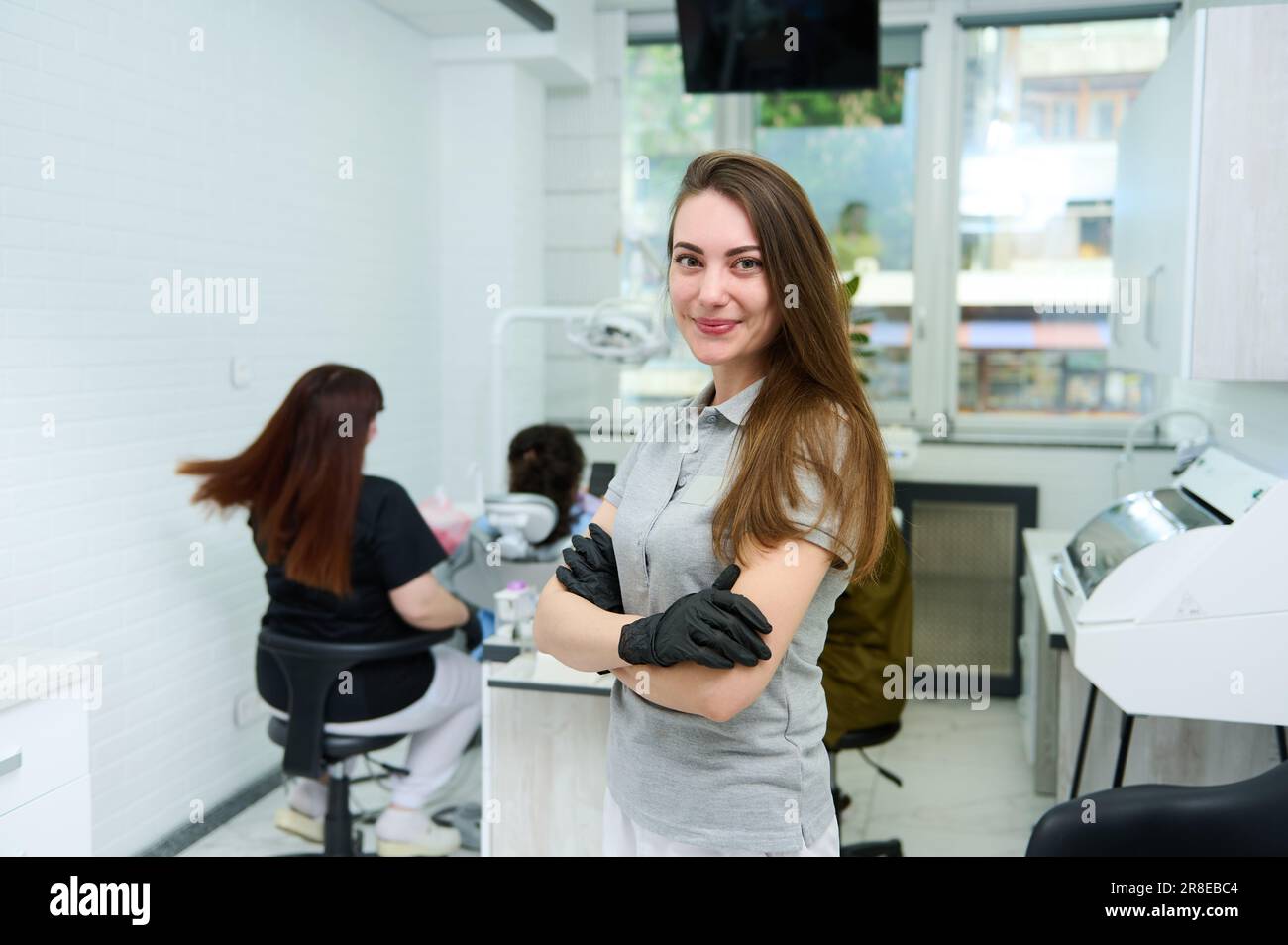 Caucasian pretty female dentist doctor maxillofacial surgeon with ...