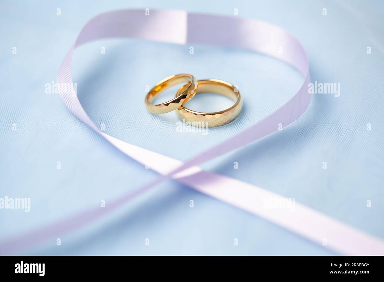 Golden wedding rings for engagement. Marriage golden rings with white ...