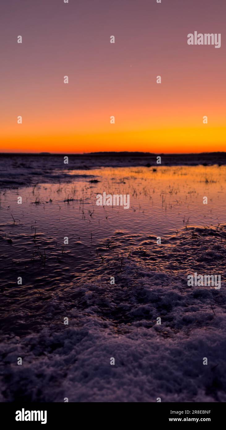 A stunning body of water illuminated by the warm colors of a sun-kissed ...