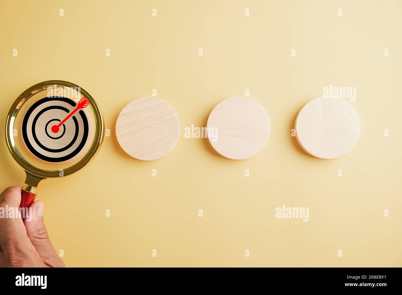 Target board inside magnifier glass for focus business objective Stock ...