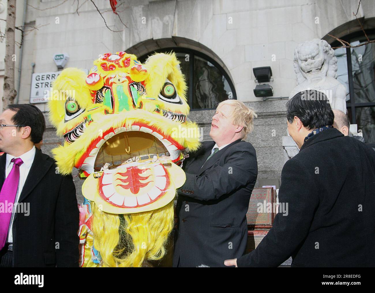 London Mayor Boris Johnson holds a Chinese Dragon costume in London's ...