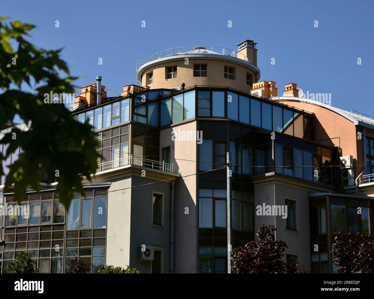 A scenic view of a modern layered architecture with a circular rooftop ...