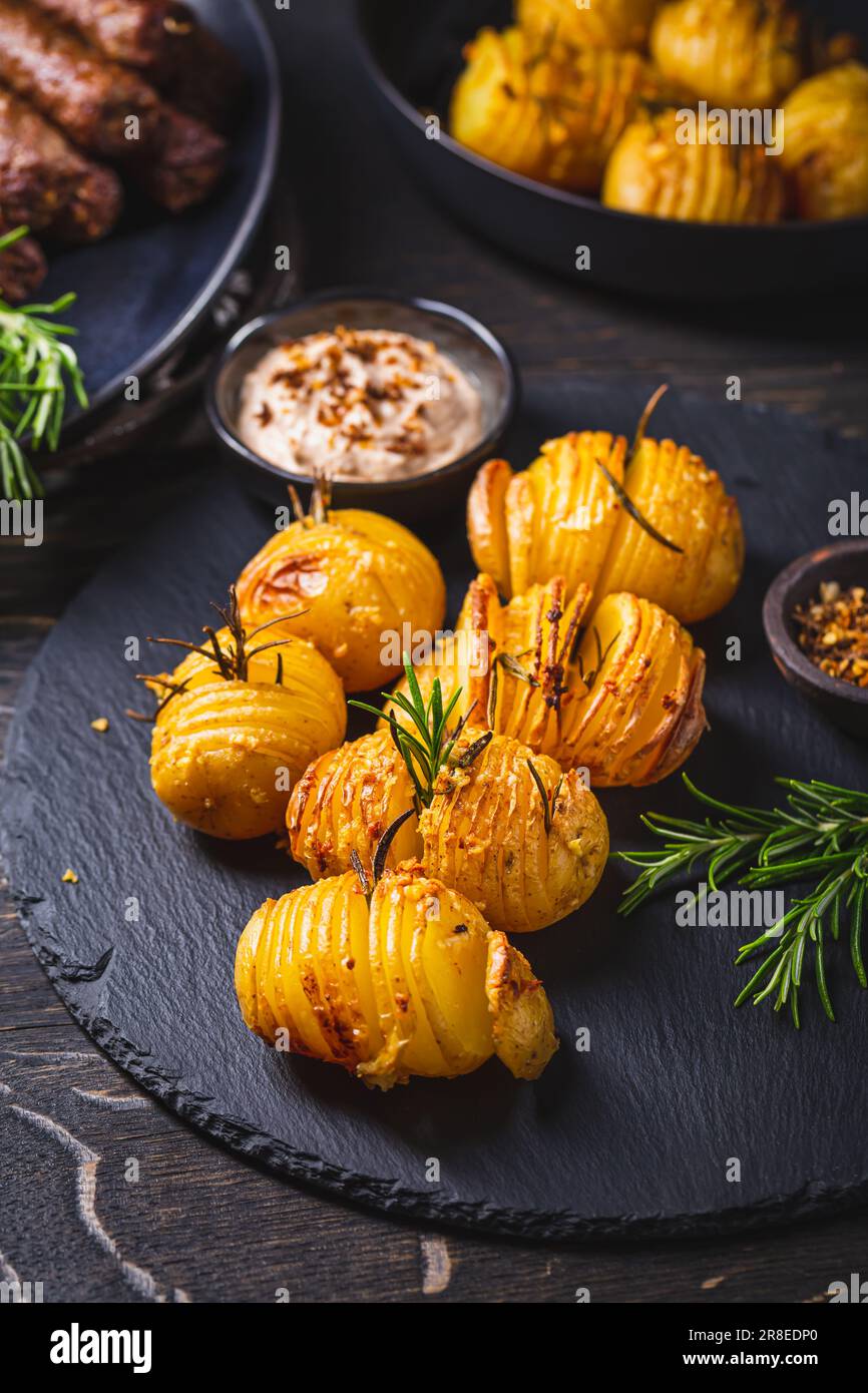 Hasselback potatoes (potato fans) with additional herbs, spices and ...