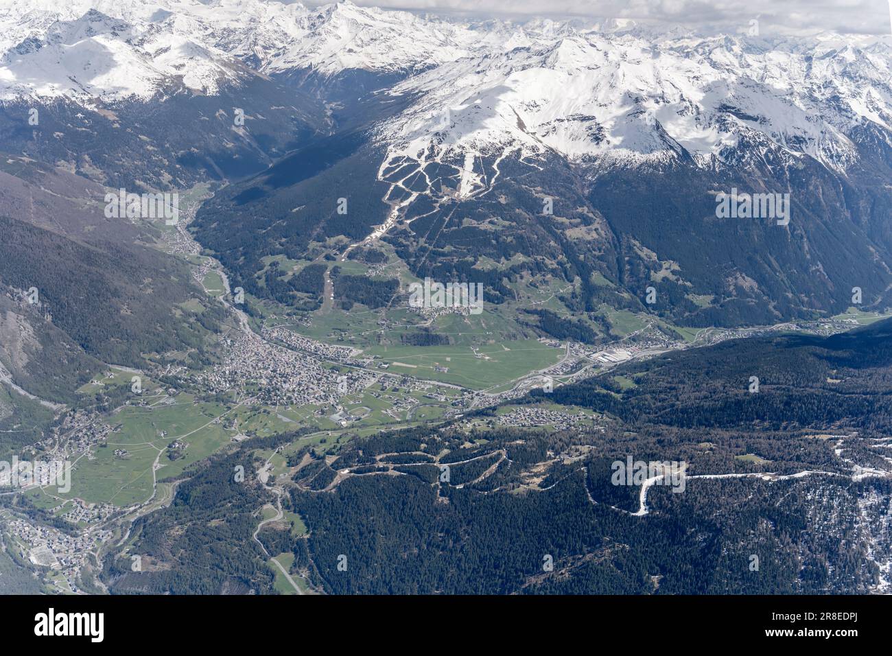 aerial landscape, from a glider plane, of Bormio touristic mountain ...