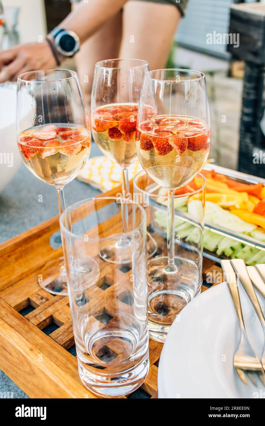 Summer strawberry wine cocktails with healthy snacks on terrace Stock ...
