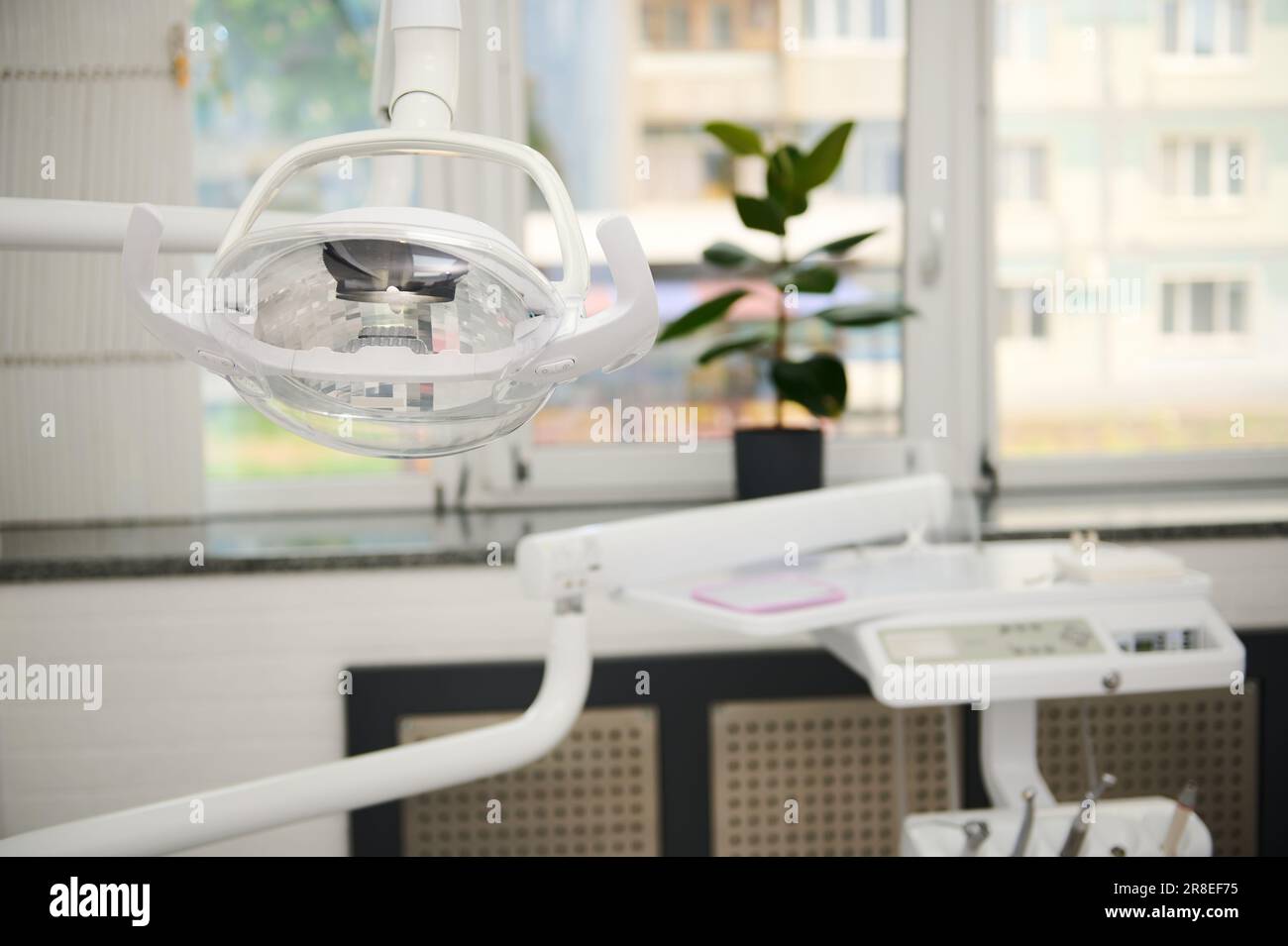 Dental office interior. Dental equipment. Operating surgical lamp with ...