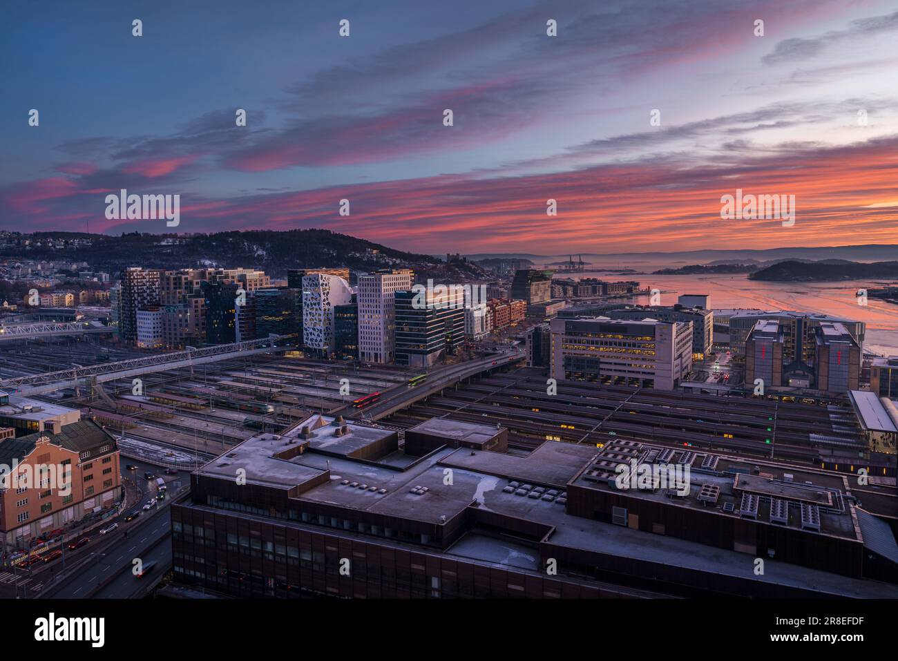 A beautiful sunset at Oslo and Oslo Fjord with the Munch Museum in the ...