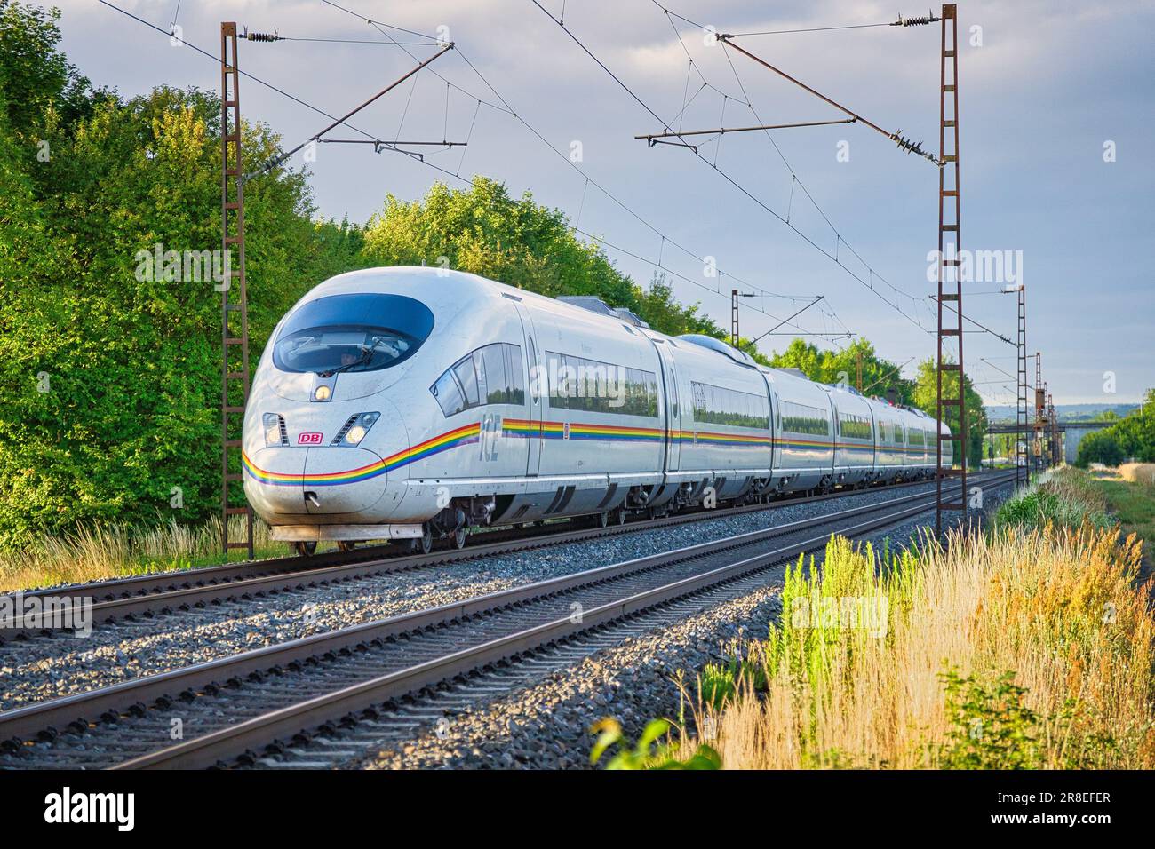 A high-speed train moving along the tracks Stock Photo - Alamy