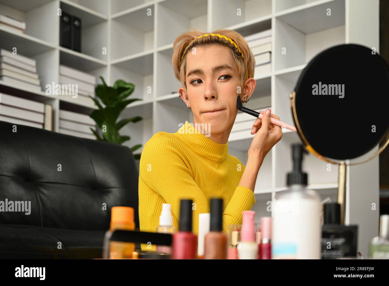 Man applying makeup transgender hi-res stock photography and images - Alamy