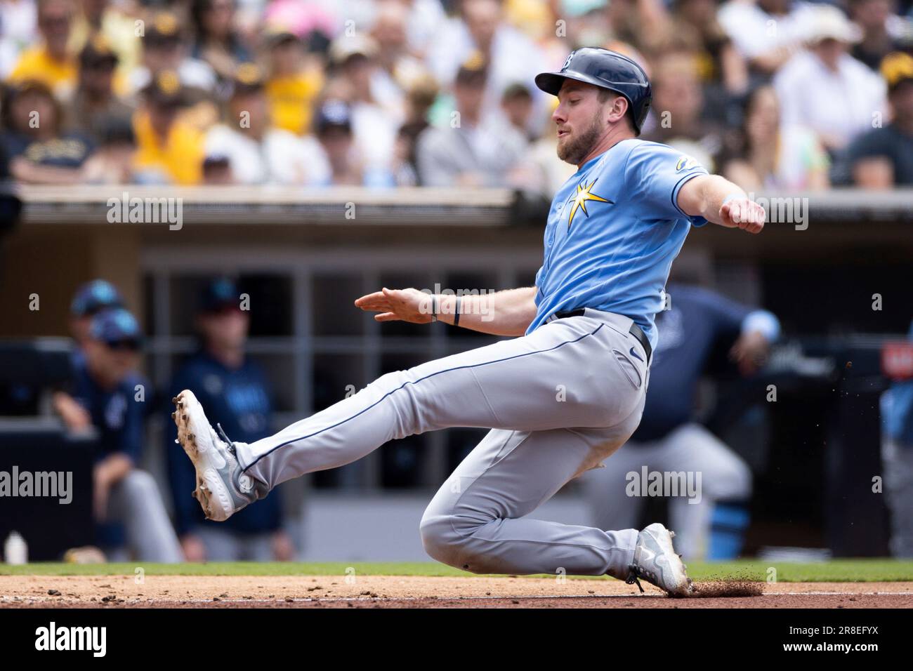 Tampa Bay Rays' Luke Raley slides into home plate safely on a sacrifice ...