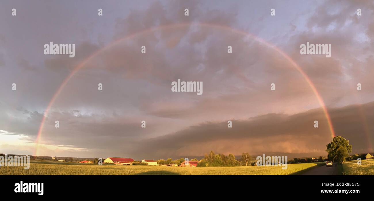 A spectacular natural phenomenon of a double rainbow illuminating the ...