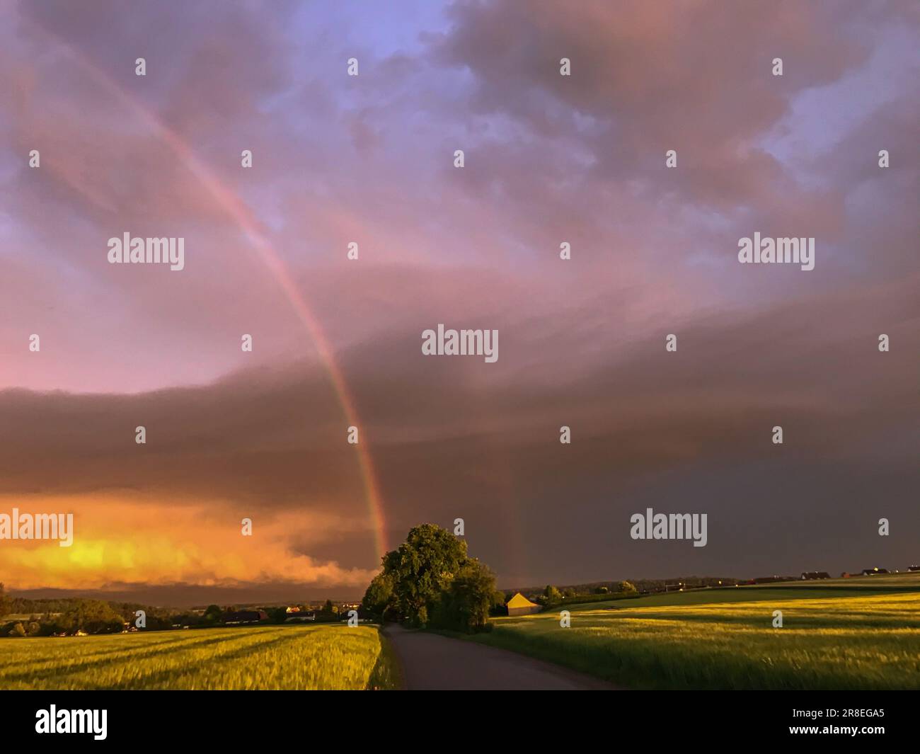 A spectacular natural phenomenon of a double rainbow illuminating the ...