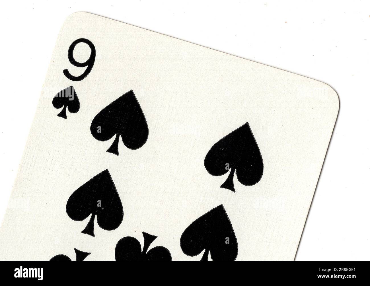 A nine of spades vintage playing card on a white background Stock Photo ...
