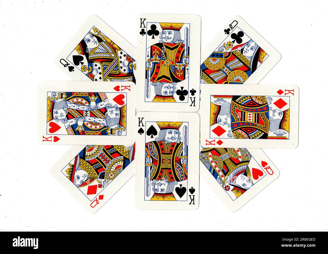 A display of vintage playing cards featuring kings and queens on a ...