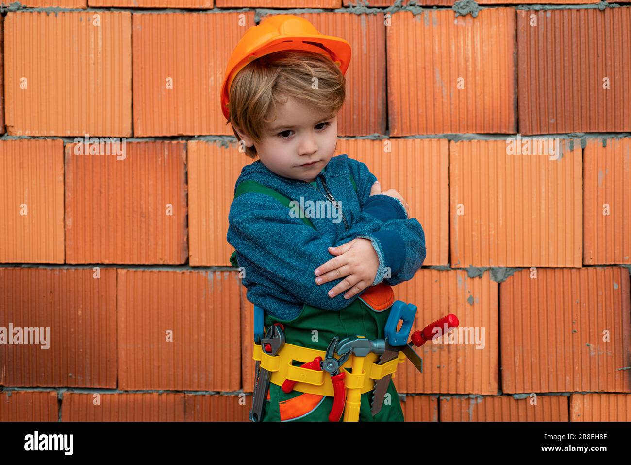 Child construction worker. Little boy to use Carpenter tools and ...