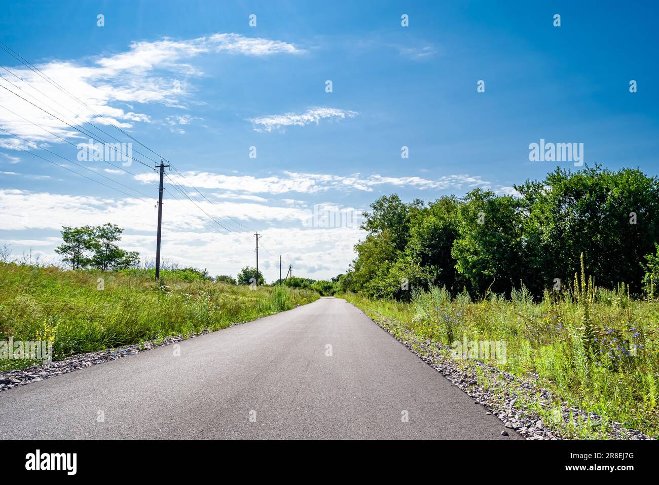 Beautiful empty asphalt road in countryside on colored background ...