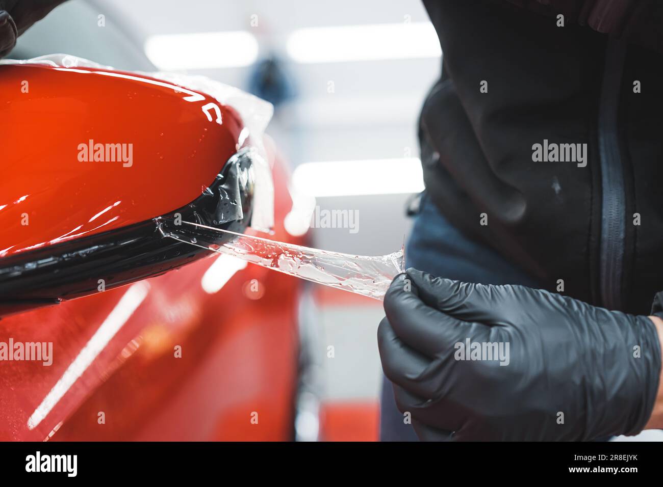 Removing process of car detailing vehicle transparent vinyl foil done ...