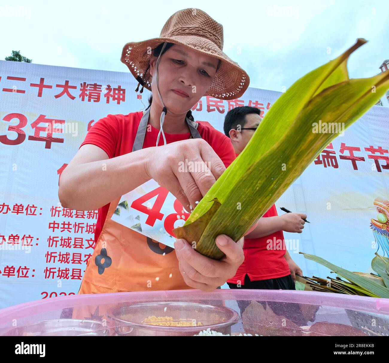 People compete to make zongzi, or sticky rice dumplings in Laibin City ...