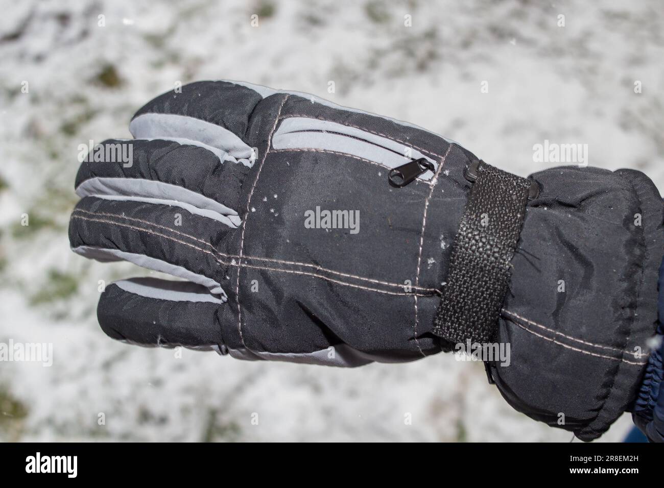 protection from cold in winter, black gloves on hand Stock Photo - Alamy