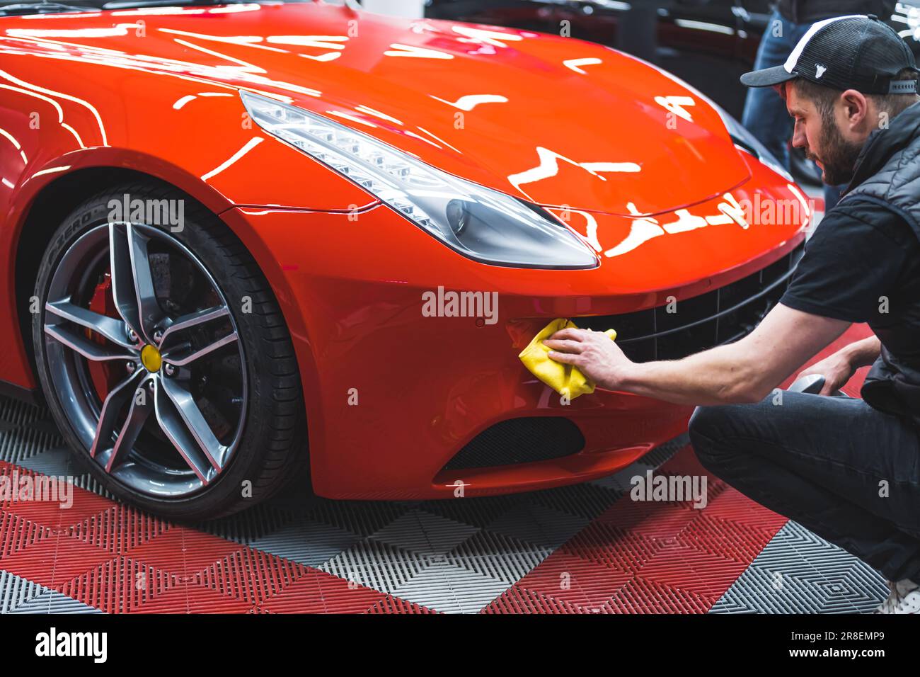 Car mechanic fixing a red car hi-res stock photography and images - Alamy