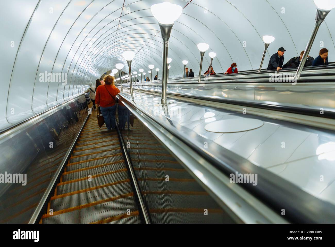 Walking up escalator underground hi-res stock photography and images - Alamy