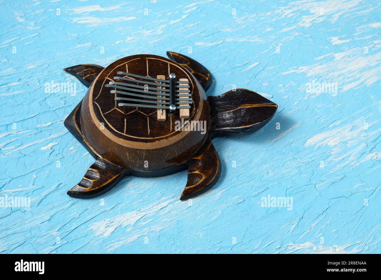 Kalimba turtle on a blue background. Traditional instrument from Africa ...