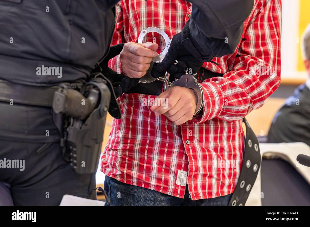 Police man hand cuffs hi-res stock photography and images - Alamy