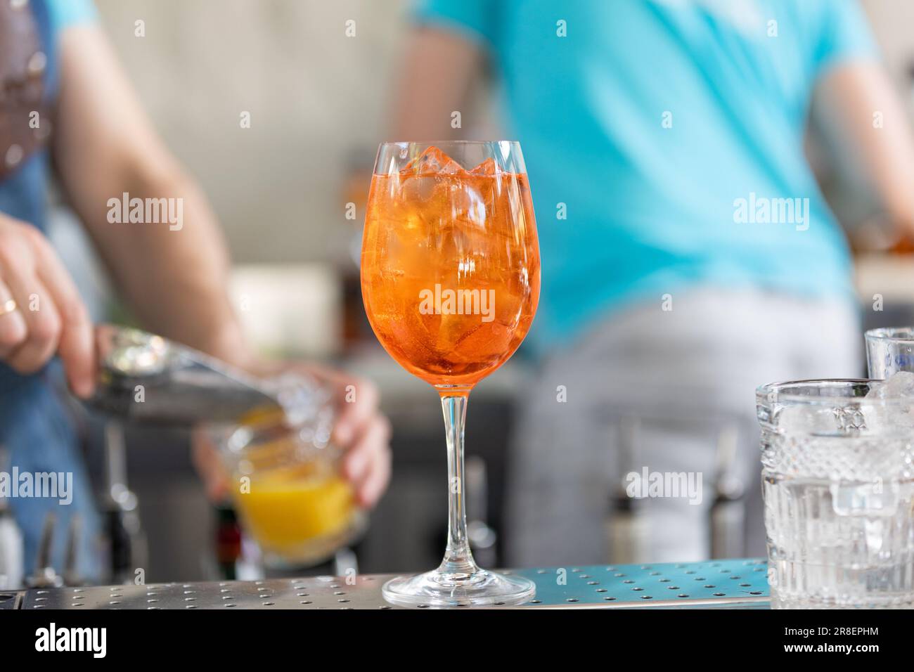 Classic Italian Aperol Spritz cocktail standing on the bar on the ...