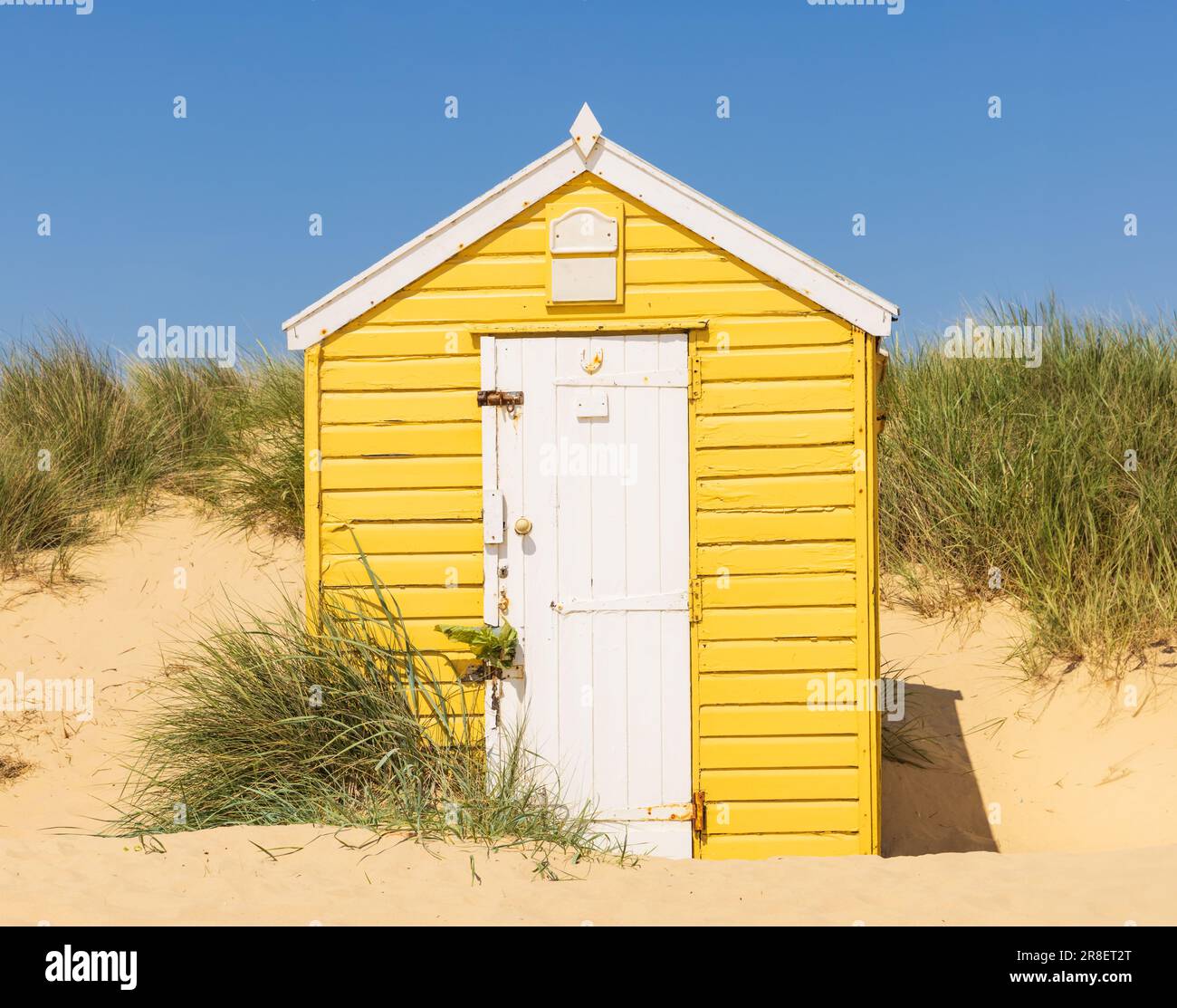 Colourful wooden beach huts on the sandy beach in Southwold, Suffolk ...