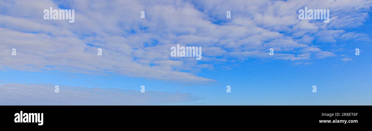 Image of a partly cloudy and partly clear sky during the day without ...